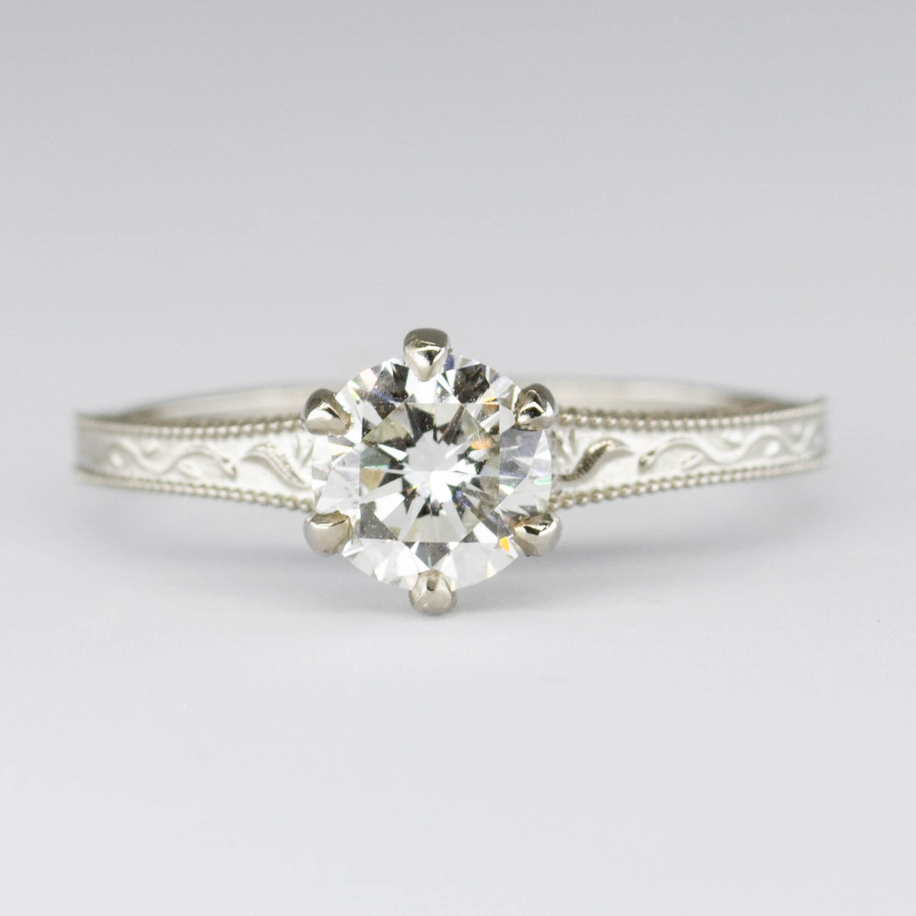 '100 Ways' Six Prong Carved Diamond Solitaire 18k Ring | 0.74ct VS1 J/